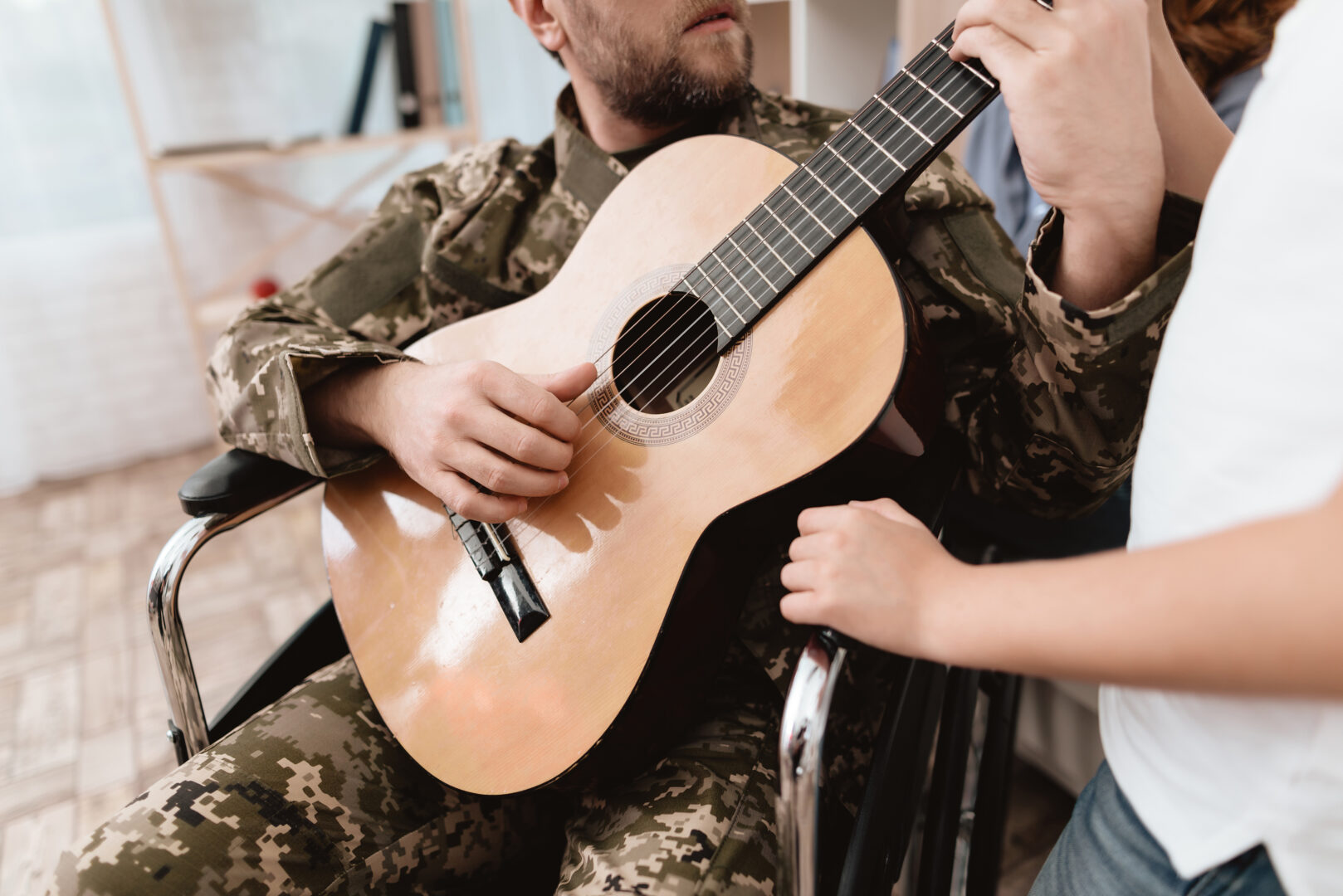 Guitars4Vets uses music to ease the pain of struggling veterans | The Spark